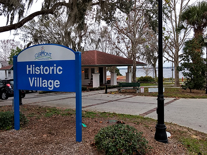 Clermont's Historic Village sign promises a glimpse into Florida's past—before mouse ears and retirement communities became the state's defining features.