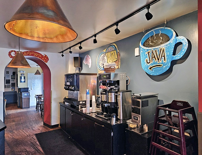 Even the coffee station sports whimsical art – because at Katzinger's, they understand that personality is as important as pastrami.