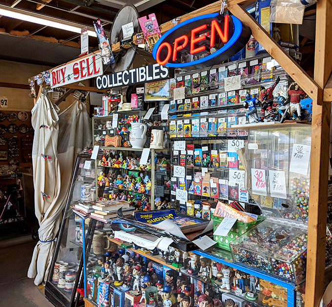 "Buy & Sell" isn't just a sign—it's a philosophy at this booth where pop culture treasures await their perfect match.