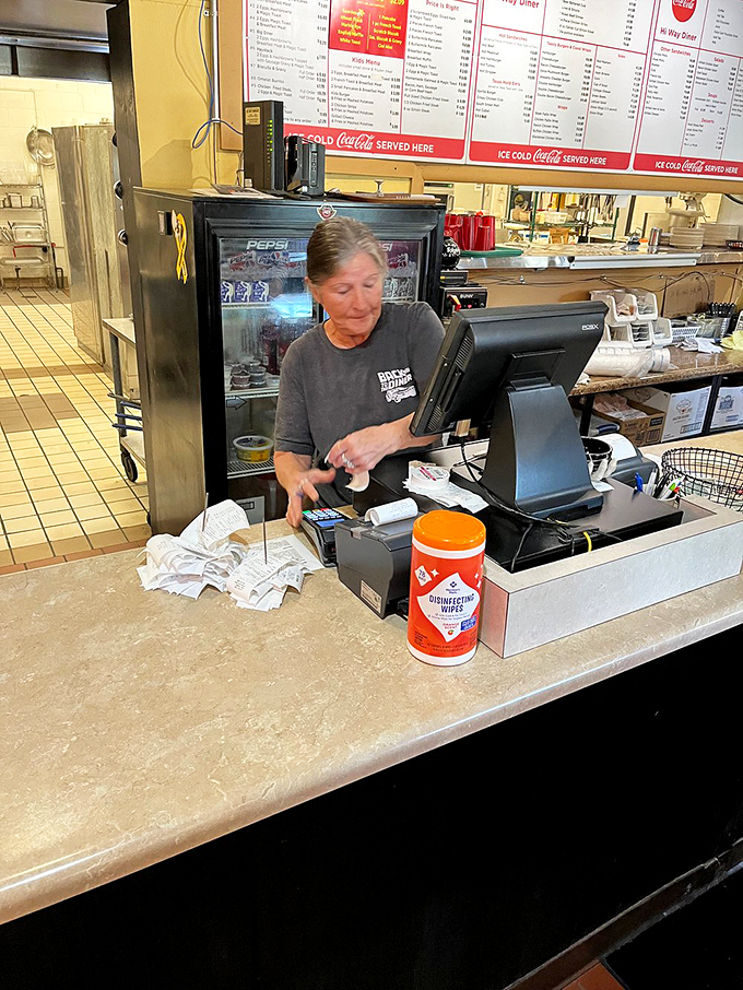 The counter—where solo diners find community, regulars have "their spot," and servers perform the silent coffee refill dance with practiced precision.