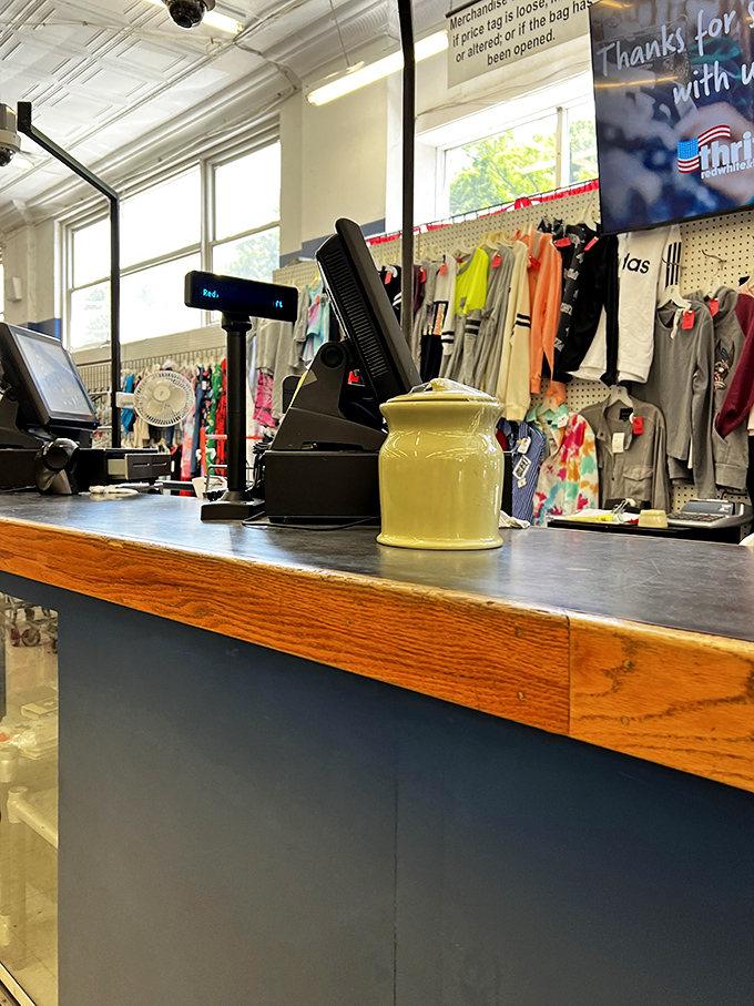 The checkout counter—the finish line where victorious bargain hunters complete their thrifting marathon with wallets still intact.