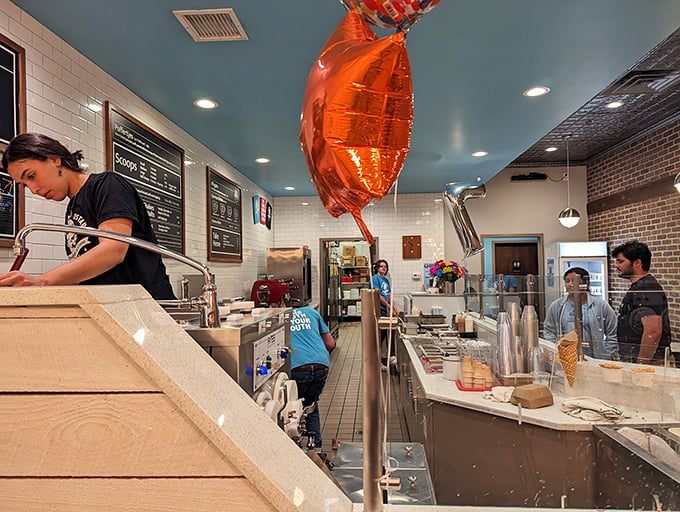 Balloon celebrations and custard creations—clearly someone knows how to party. The pristine prep area hints at the precision behind each scoop.