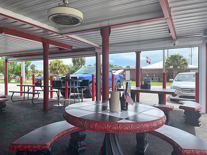 Covered patio seating where Florida breezes complement burger aromas. The perfect spot to enjoy your feast while watching the world drive by.