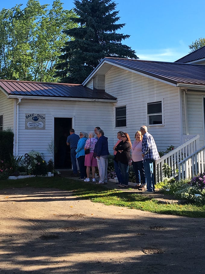 The line outside says everything you need to know—people willing to stand in the summer sun understand that patience leads to pastry perfection.