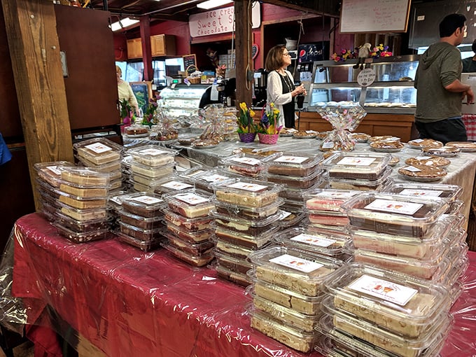 A bustling interior where pie pilgrims gather to worship at the altar of homemade goodness. The stacked containers suggest many won't be leaving empty-handed.