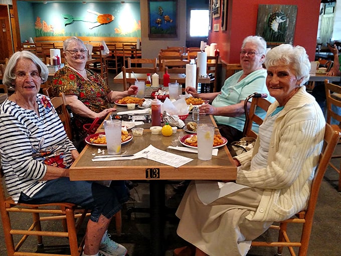 These diners know the secret to happiness: good company, cold drinks, and plates full of seafood in a place where nobody rushes you.