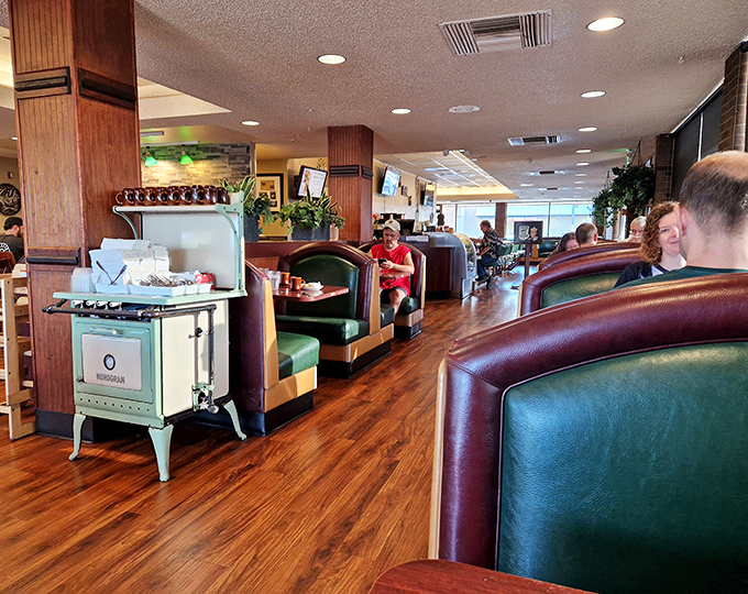 Classic green booths create that timeless diner ambiance where conversations flow as freely as the coffee refills.