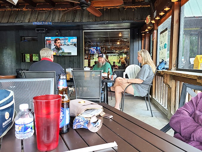 The outdoor seating area—where fresh air, cold drinks, and the background hum of conversation create the perfect recipe for a leisurely afternoon.