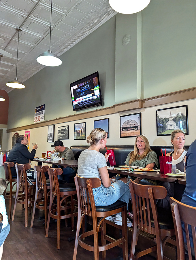 High-top tables create the perfect perch for people-watching while debating the merits of thin versus thick crust – a conversation as old as time itself