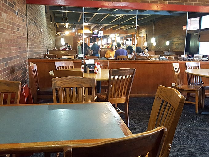 Simple wooden tables and chairs create the perfect stage for the real star of the show—the food. No distractions, just dining.
