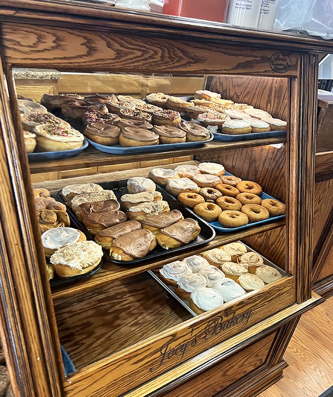 Donut nirvana behind glass! These aren't just pastries—they're edible works of art waiting to make your coffee break memorable.