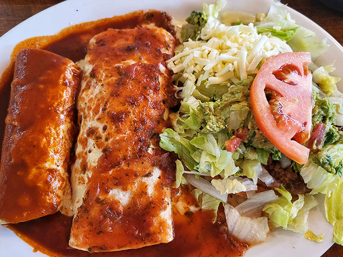 These enchiladas aren't just served – they're presented with the confidence of something that knows it's about to rock your world.