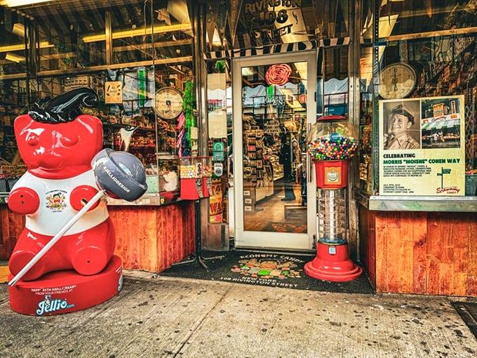 The entrance guardian – a giant red bear – stands watch over this temple of treats, welcoming pilgrims on their sugar-seeking journey.