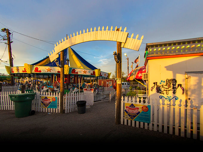 The carnival entrance beckons with promises of rides, games, and that special kind of old-fashioned American fun. 