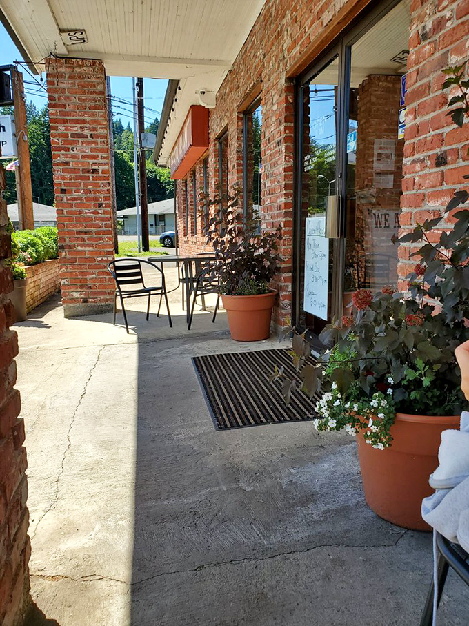 The entryway beckons with potted flowers and simple charm. No velvet ropes here—just genuine coastal hospitality waiting inside.