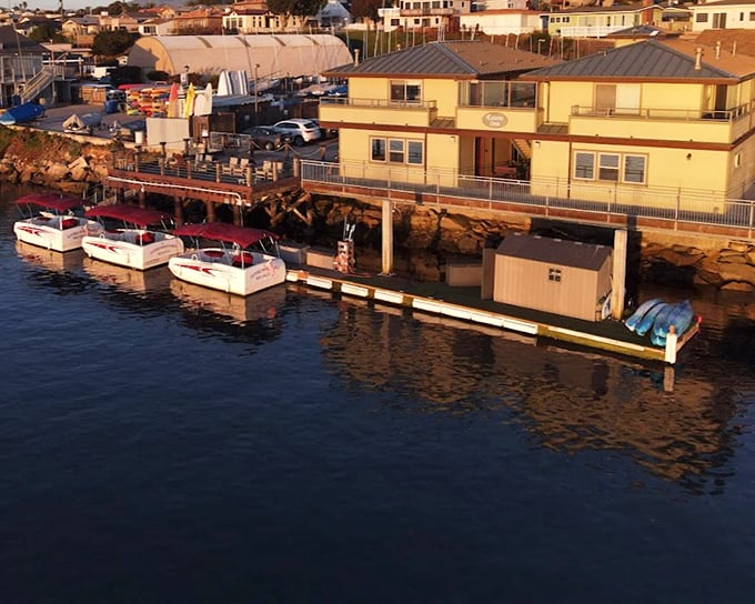 Watercraft lined up like eager puppies, ready to take visitors exploring the protected waters of this Central Coast haven.
