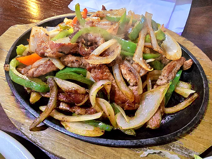 Sizzling fajitas announce their arrival before you see them. This hot skillet of perfectly seasoned meat and vegetables performs the most aromatic tableside show in town.