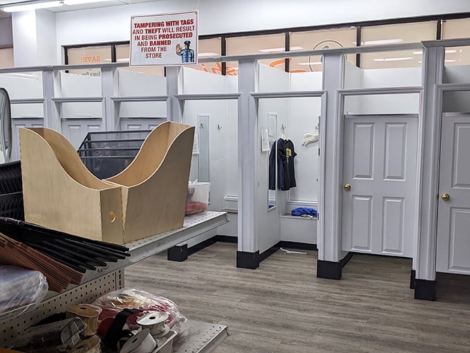 Fitting rooms await the hopeful. That sign warning against tag tampering suggests someone once got too creative with their discount hunting.