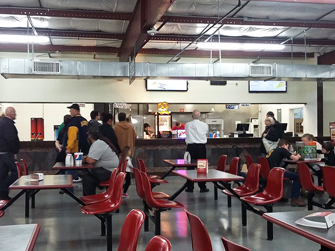 The food court – where treasure hunters refuel and compare their bounty. Those red chairs have heard more deal-bragging than a Wall Street boardroom.