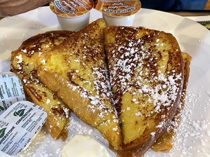 French toast that's crossed the line from breakfast to dessert. That dusting of powdered sugar is like fresh snow on Christmas morning.