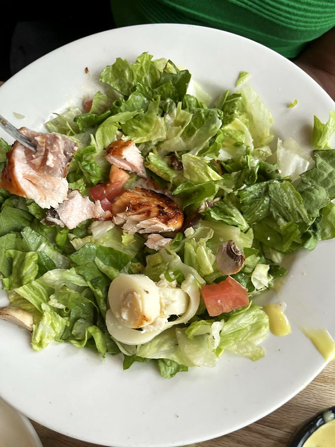 A salad that doesn't feel like punishment – fresh greens, grilled chicken, and enough goodies to make you forget you're eating something healthy.