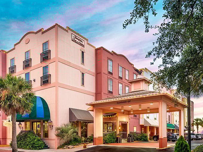 This Hampton Inn proves chain hotels can have personality – its salmon-colored façade is the architectural equivalent of a confident golf shirt.