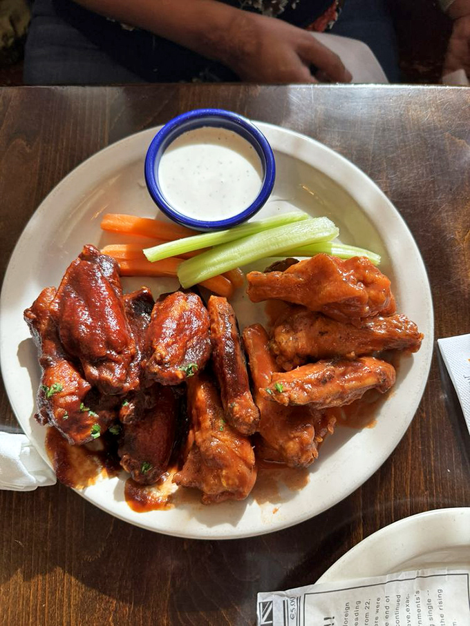 These wings aren't just hot—they're served with the traditional Irish accompaniments of celery, carrots, and enough sauce to make napkins mandatory.