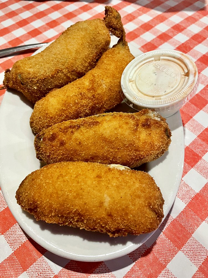 Jalapeño poppers with the perfect golden crust—little packages of creamy, spicy joy that disappear from the plate with suspicious speed.
