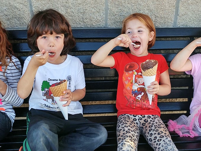 Pure, unfiltered joy—the universal language of kids experiencing great custard. No emoji could ever capture this level of authentic delight.