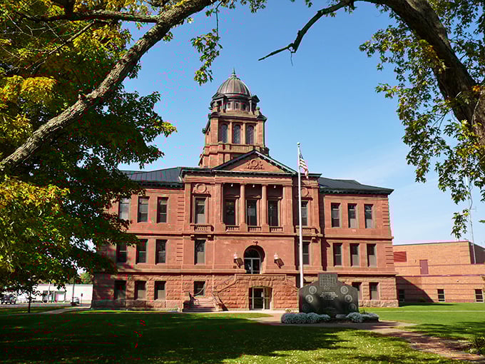The county courthouse stands as red-bricked authority – impressively governmental without being intimidating, like a stern but fair grandfather.