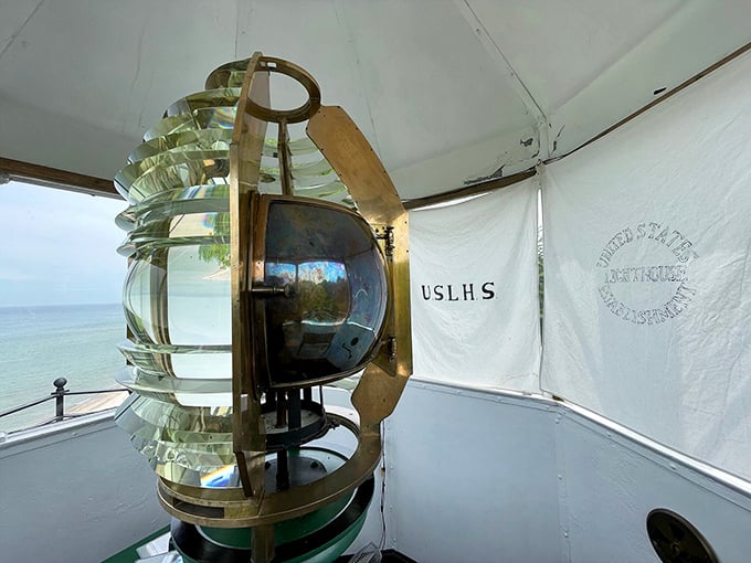 The Fresnel lens—the technological marvel that made lighthouses truly effective—still gleams with the precision engineering that saved countless lives.