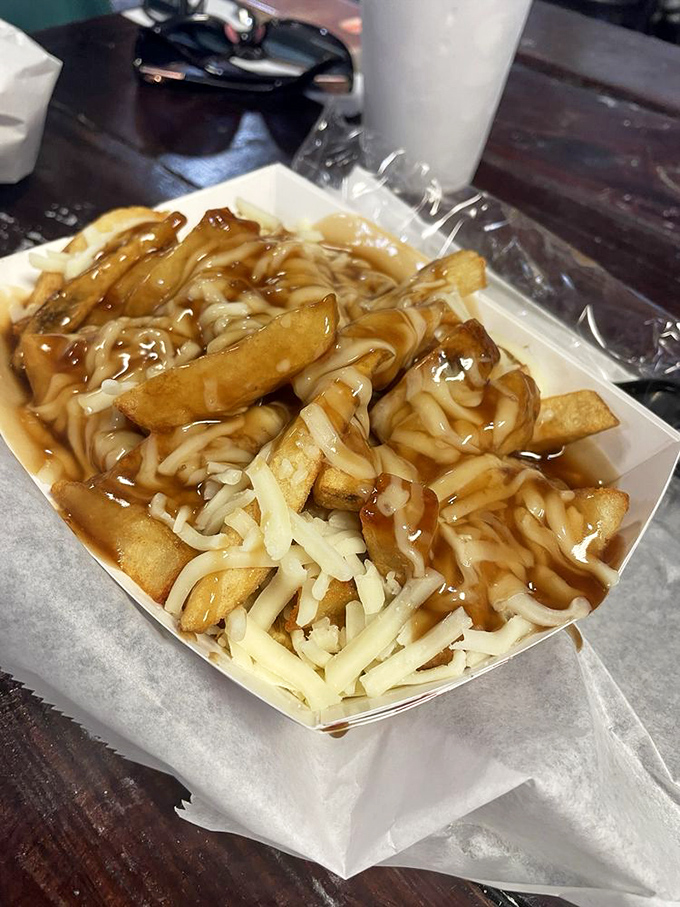 Chips smothered in gravy and cheese—the Manchester Special that makes you wonder why Americans haven't embraced this brilliant combination sooner.