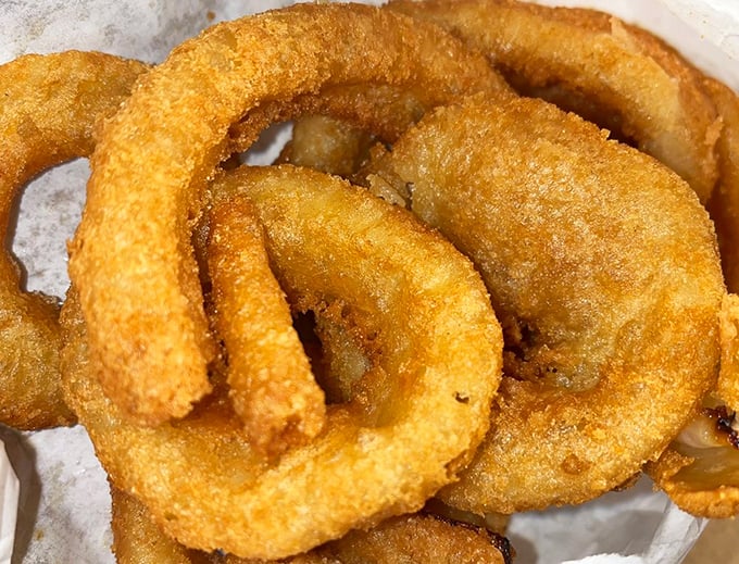 These aren't just onion rings—they're golden halos of crispy perfection that deserve their own place in the side dish hall of fame.
