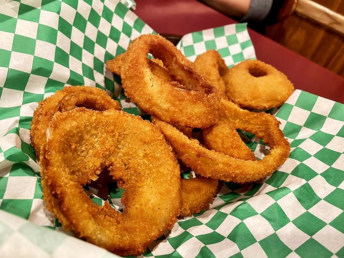 These aren't just onion rings—they're golden halos of happiness, perfectly crisp and ready to complement your burger adventure.