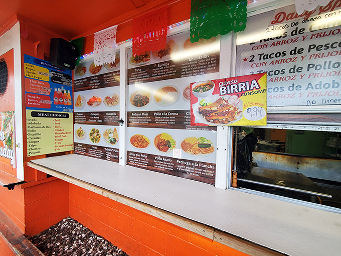 The ordering window—where dreams come true and decisions get difficult. The colorful menu boards showcase possibilities that will haunt your food fantasies.