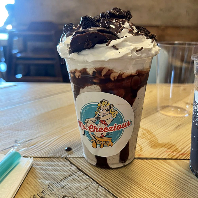 This Oreo milkshake isn't just a drink – it's a dessert skyscraper with whipped cream penthouses and cookie condominiums.