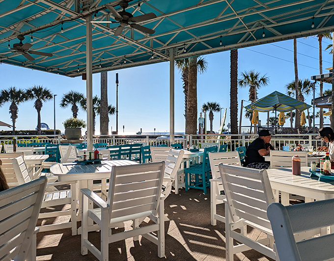Ocean views and white Adirondack chairs—a combo more perfect than peanut butter and jelly. This is where memories get made between bites.