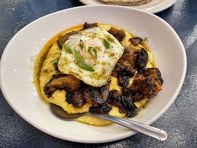 Cheesy grits crowned with oxtail and a sunny-side-up egg—Southern comfort food elevated to art form. Fork-ready decadence.