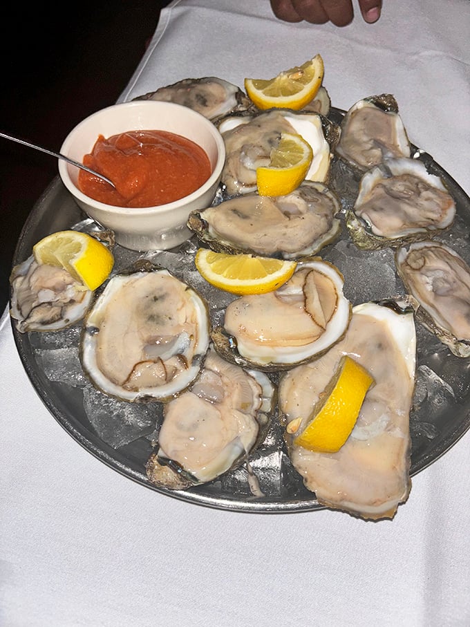 These oysters aren't just seafood—they're briny jewels from the ocean, served with lemon crowns and a cocktail sauce that means business.