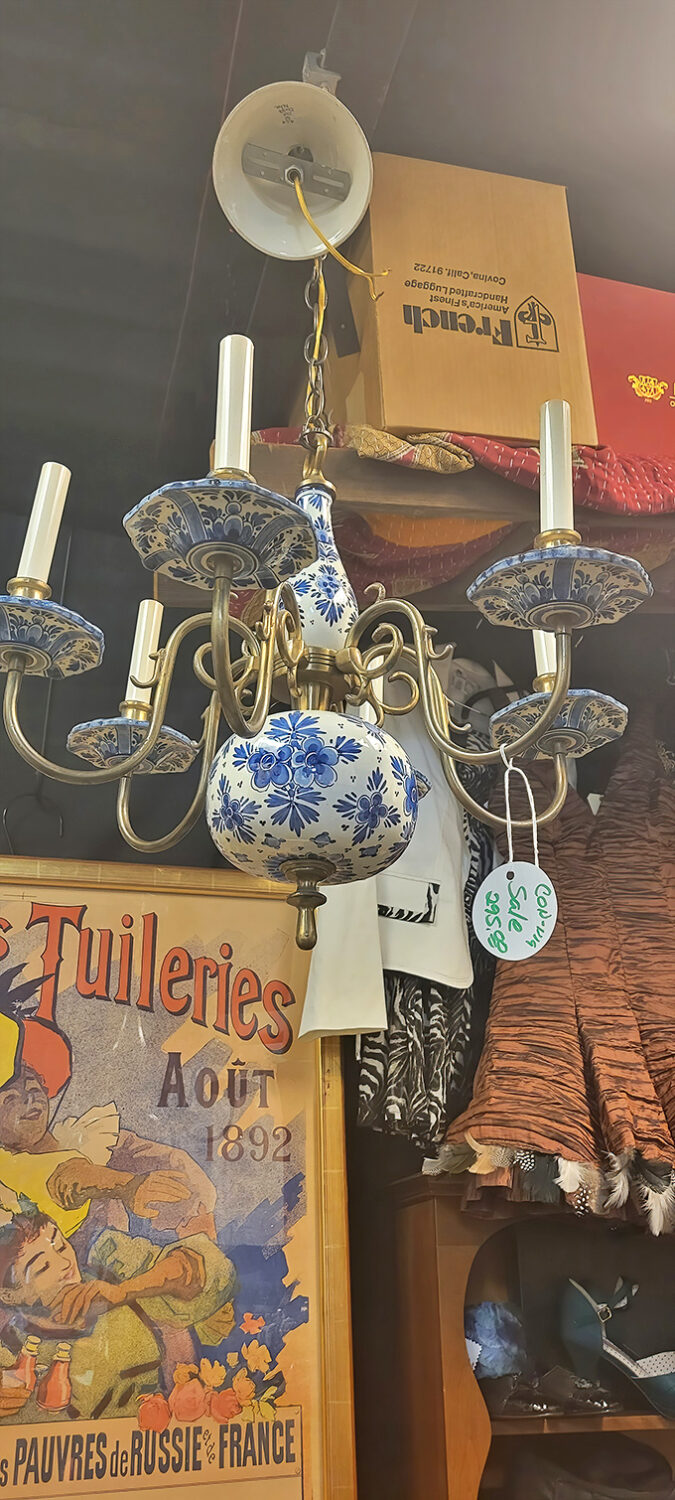 Delft-inspired porcelain meets brass in this stunning chandelier—proof that lighting fixtures were once considered functional art rather than mere utilities.