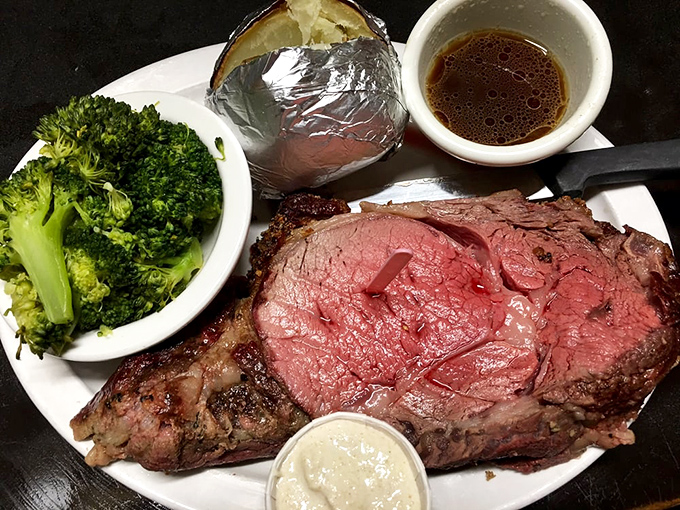 Prime rib cooked with the respect it deserves—pink in the middle, seasoned crust, with sides that know their supporting role in this meaty masterpiece.