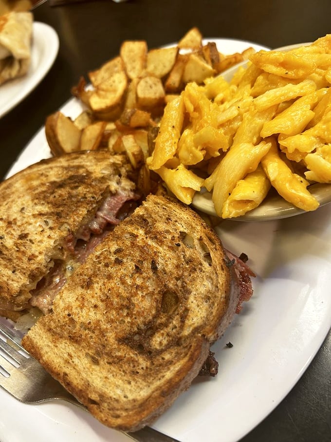 A grilled sandwich that makes you question why anyone would eat anything else. Golden-brown bread, melty cheese, and sides that turn lunch into an event worth savoring.