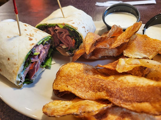 This roast beef wrap with house-made chips isn't just lunch—it's edible architecture with layers of flavor in every bite.