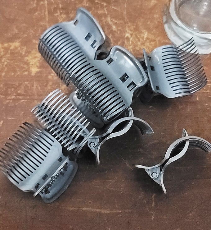 Hair tools from decades past cluster together like old friends at a reunion—the 80s volume-makers and 90s styling clips awaiting fashion's inevitable return.