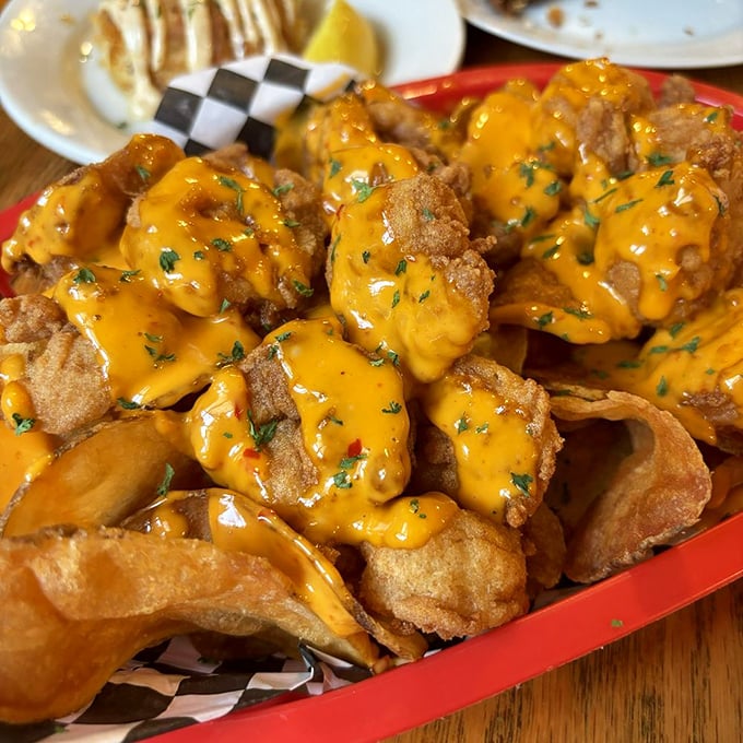 These golden-fried shrimp, draped in cheese sauce, aren't just an appetizer—they're the opening act of a culinary concert you won't forget.