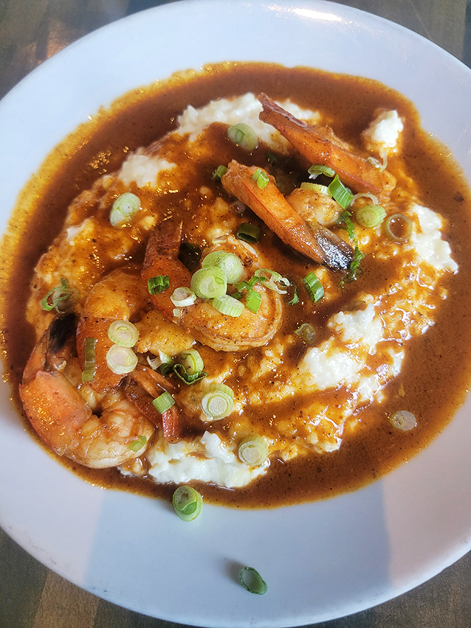 Shrimp and grits get the royal treatment here—plump crustaceans lounging in rich sauce atop creamy grits. Southern comfort meets St. Louis soul.