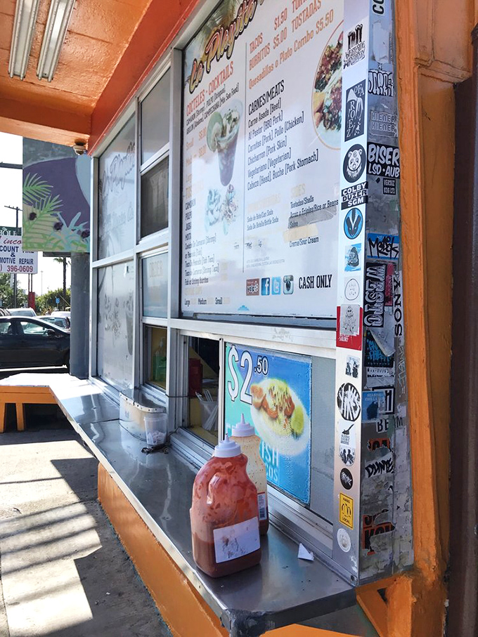 Stickers tell a story of culinary pilgrimage—each one representing another food adventurer who came, saw, and devoured.
