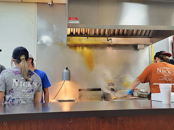 The kitchen staff working their magic behind the scenes. That sizzle isn't just noise—it's the soundtrack of anticipation.