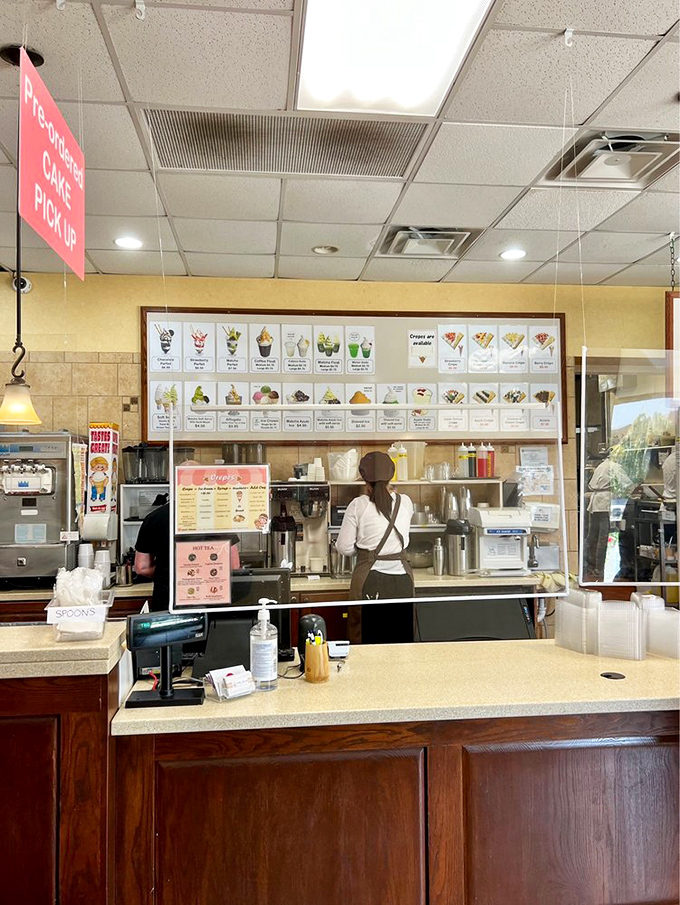 Behind every great pastry is a team of culinary artists. This counter isn't just serving food—it's delivering edible joy one perfectly crafted treat at a time.