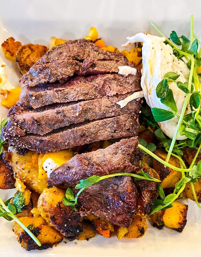 Steak and eggs—the breakfast of champions who plan to skip lunch. That perfectly medium-rare meat isn't just cooked, it's respected.